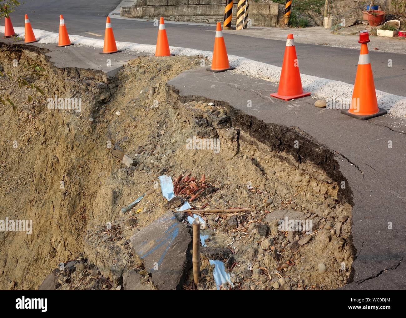 Traffic cone on broken hi-res stock photography and images - Alamy