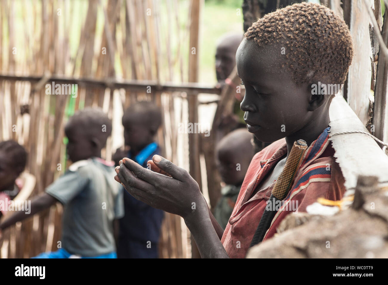 Black child prayer hands hi-res stock photography and images - Alamy