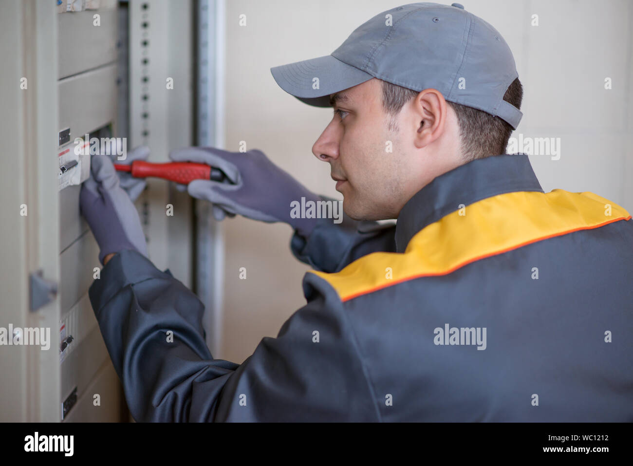 Electrician work on electrical panel hi-res stock photography and ...