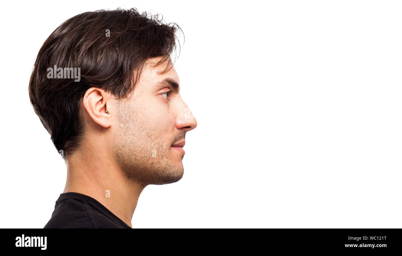 Side view of a handsome young man facial portrait isolated on a white ...