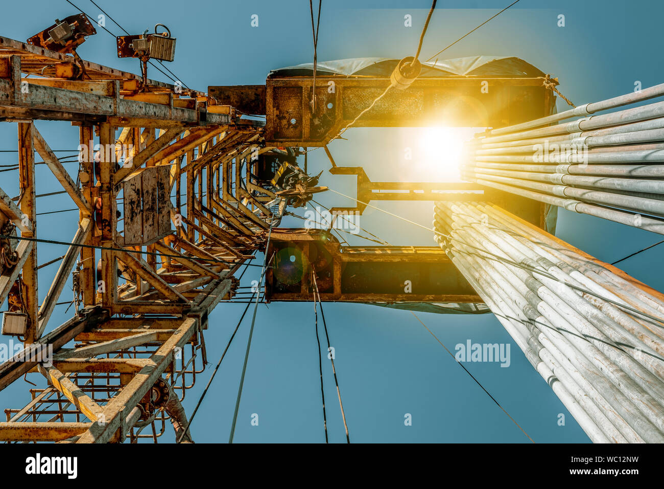 Onshore land rig in oil and gas industry. Oil drilling rig against a ...