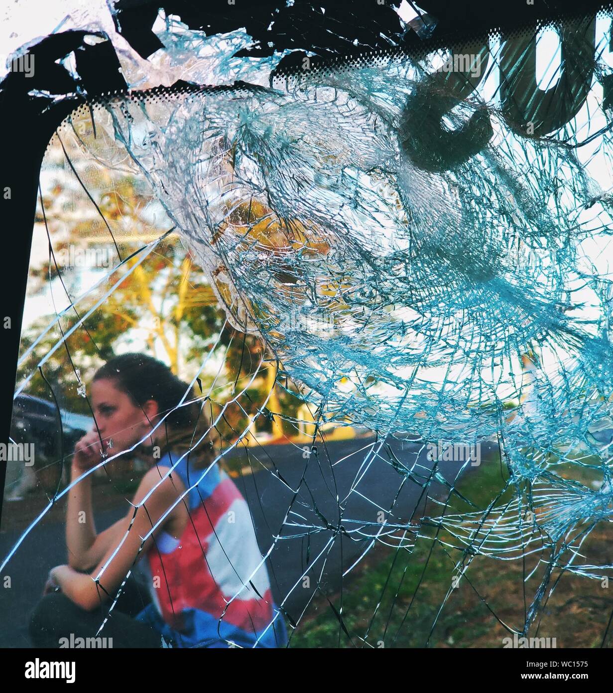 Woman broken window hi-res stock photography and images - Alamy
