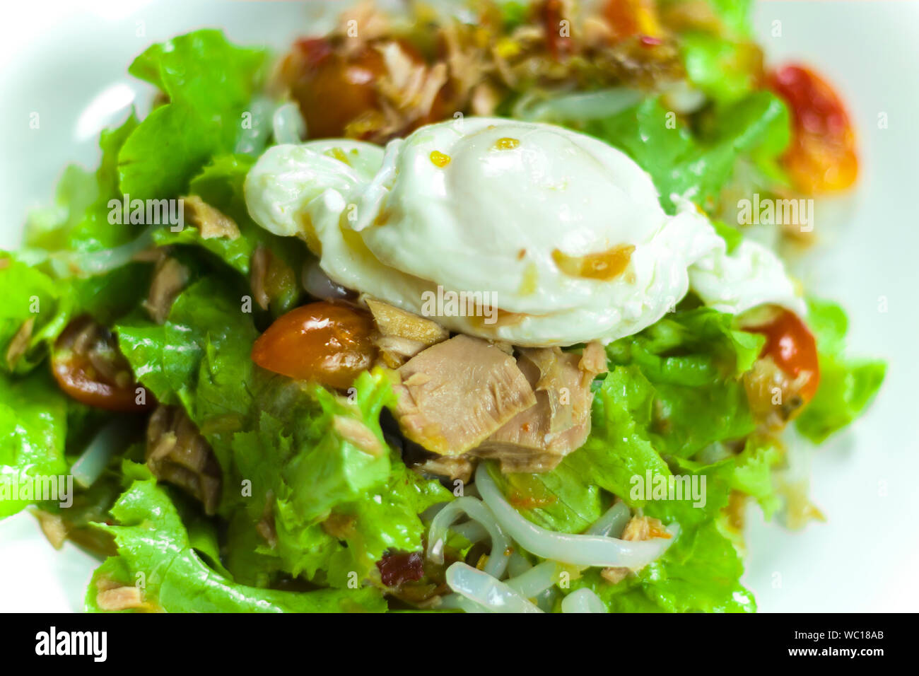 Thai tuna salad with egg, spicy Tuna Salad onion and tomatoes in plate ...