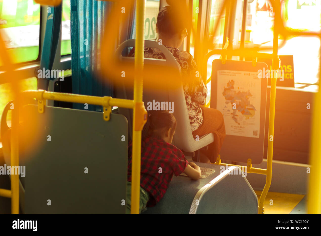 a child lays on the seat in the shaking bus. alone. High resolution ...