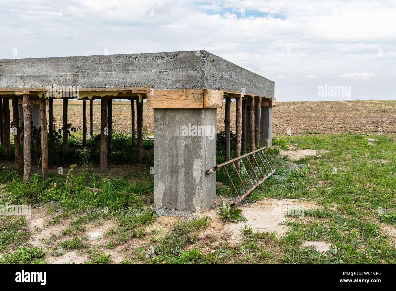 Reinforced concrete slab in the shape of a rectangle on concrete poles ...