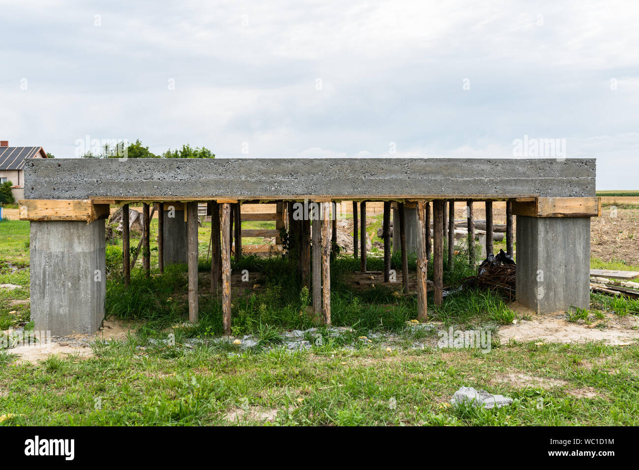 Reinforced concrete slab in the shape of a rectangle on concrete poles ...