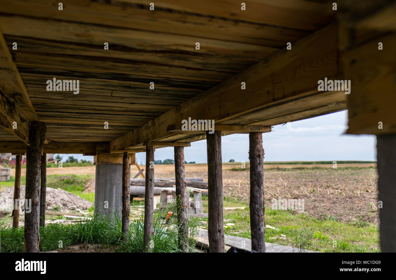 Reinforced concrete slab in the shape of a rectangle on concrete poles ...
