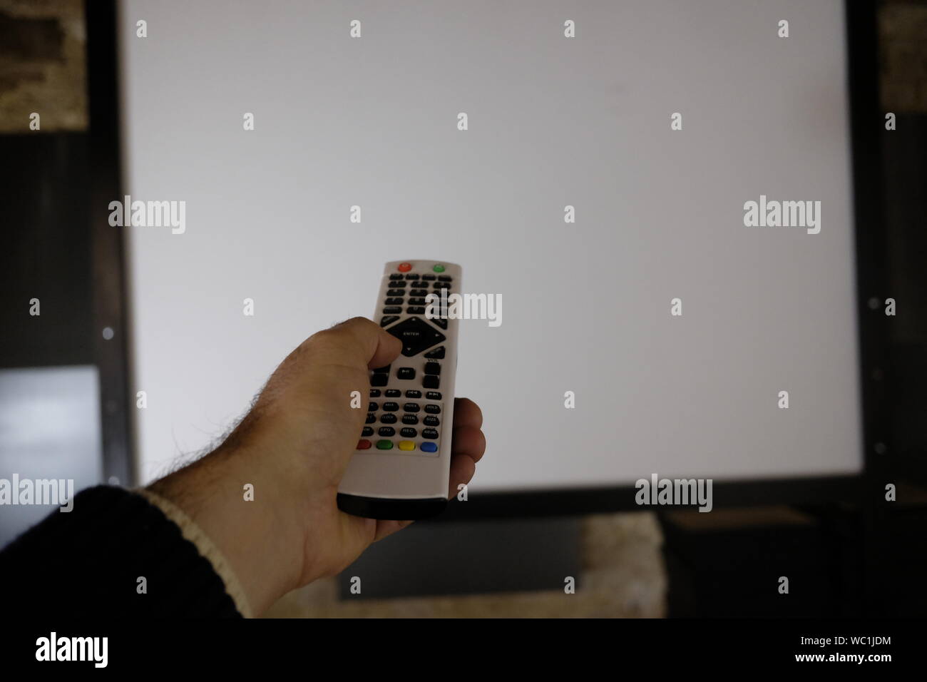 Hand using tv control hi-res stock photography and images - Alamy