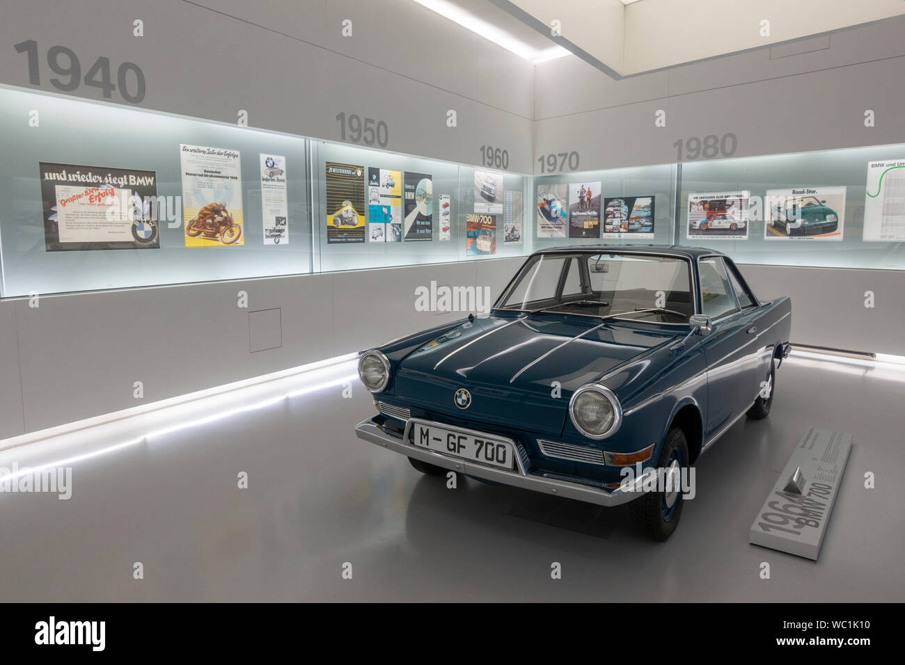 Historical advertising poster display (with a BMW 700 (1964) in the BMW ...