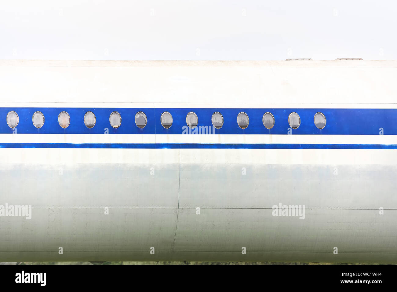 Elements of passenger aircraft with a blue stripe close-up Stock Photo ...