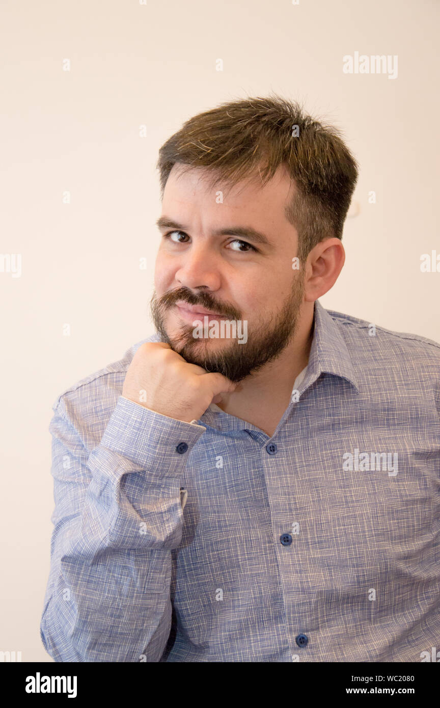 Man with hand on chin hi-res stock photography and images - Alamy