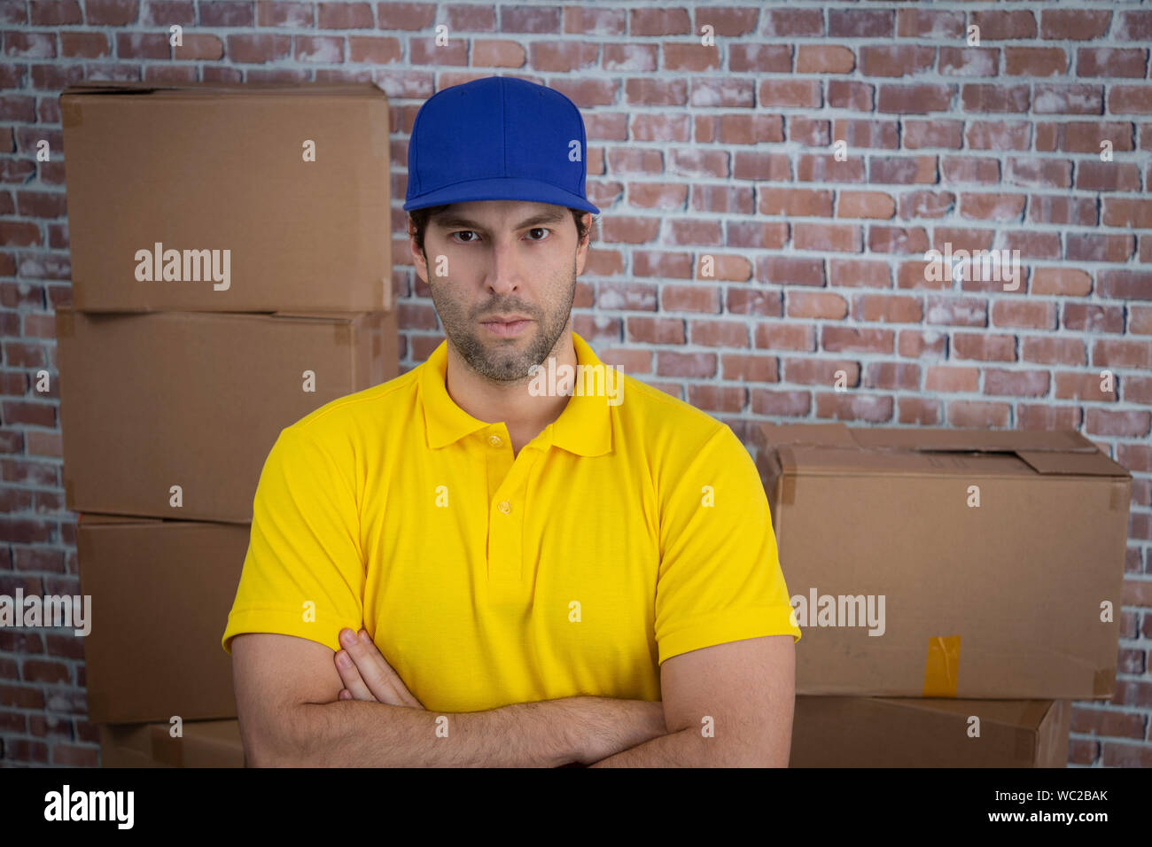 Man in work uniform arms crossed hi-res stock photography and images ...