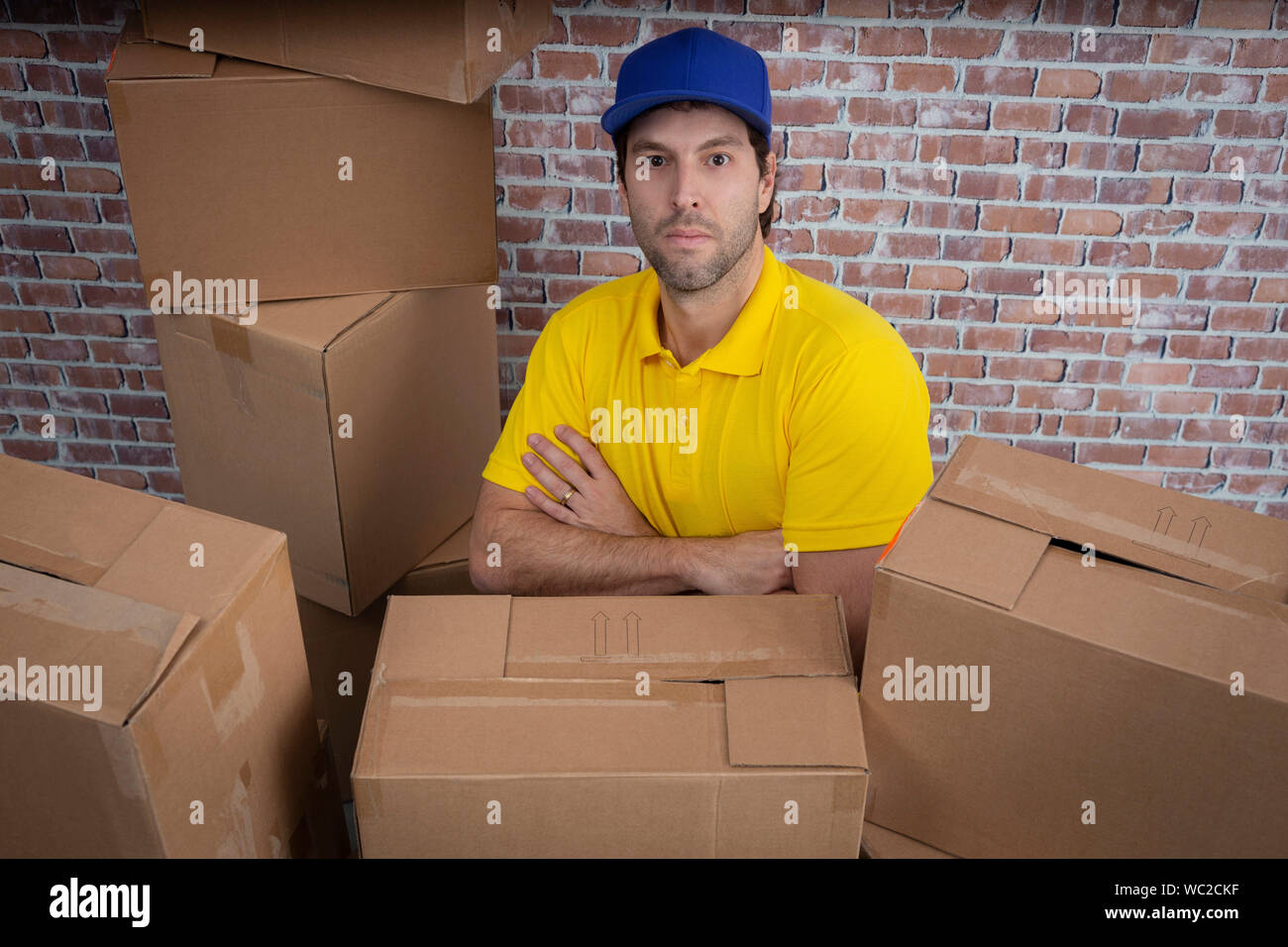 Man in work uniform arms crossed hi-res stock photography and images ...