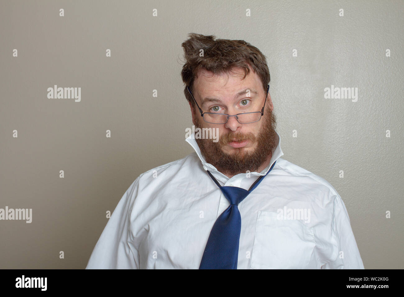 stumbling drunk man with a messy shirt and hair Stock Photo - Alamy