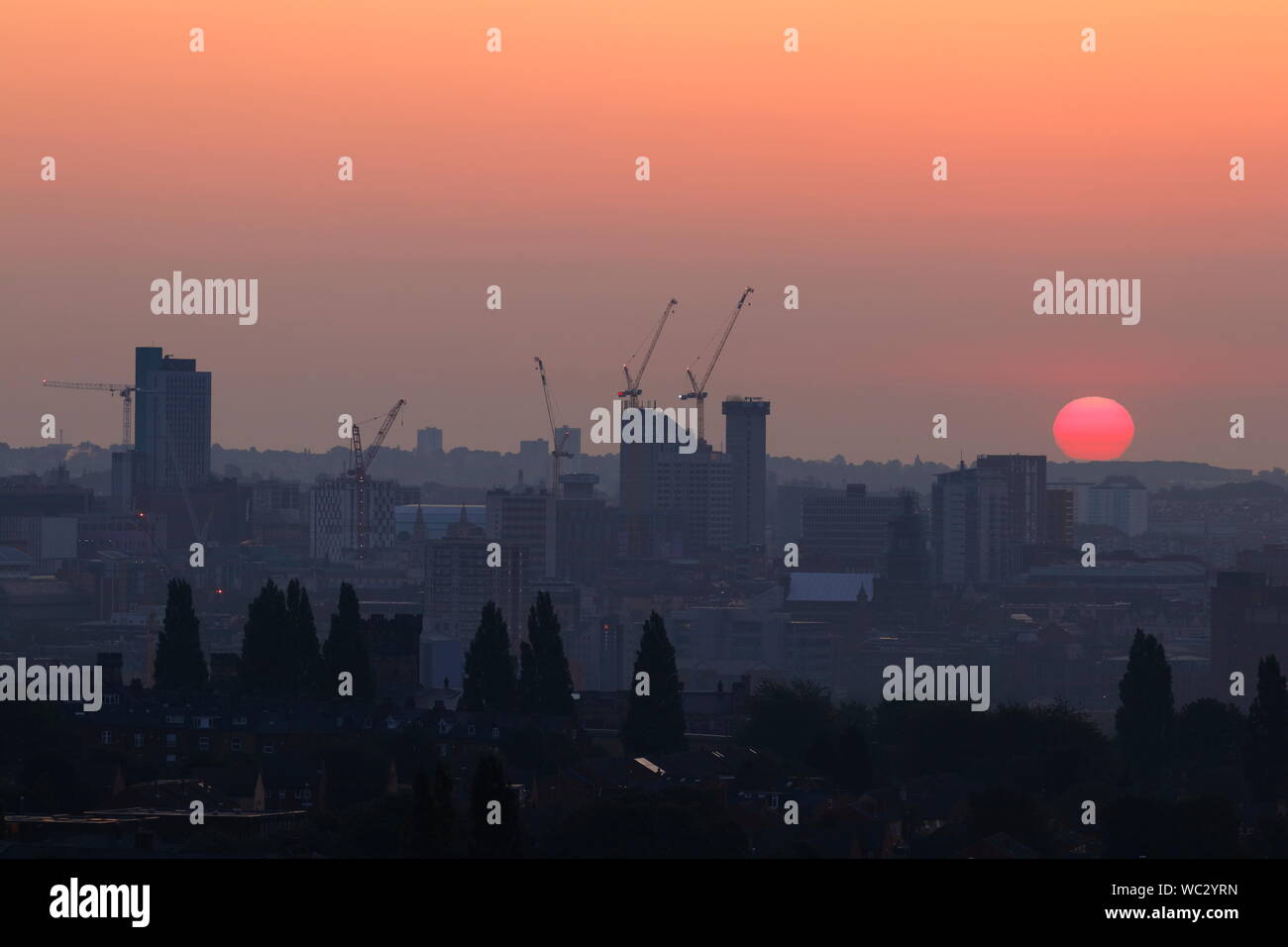 Sunrise over Leeds city centre skyline Stock Photo - Alamy