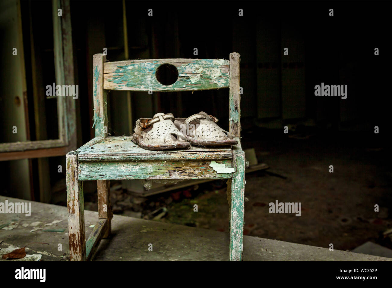 Children's shoes in the abandoned building of the kindergarten after ...