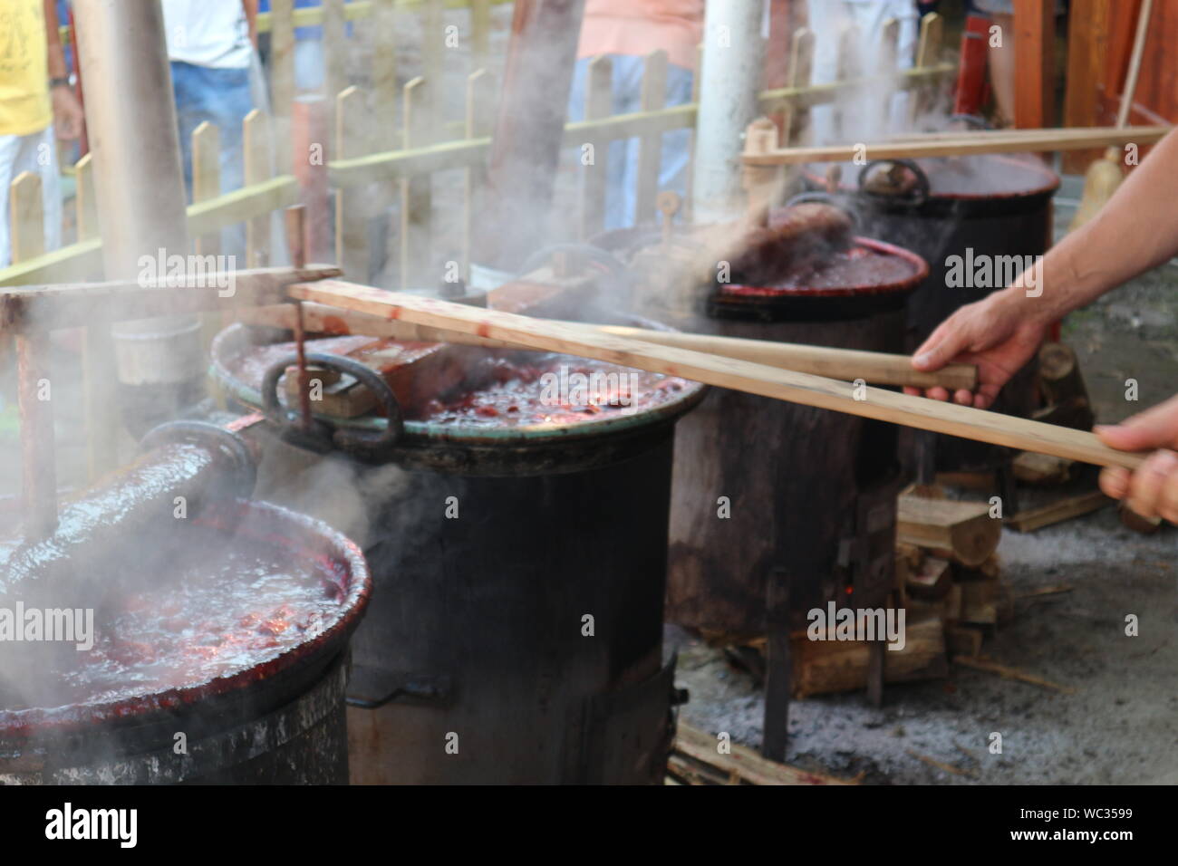 One person cooking in big pot hi-res stock photography and images - Alamy