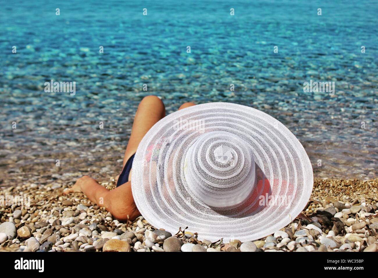 Woman beach sunbathing back hi-res stock photography and images - Alamy