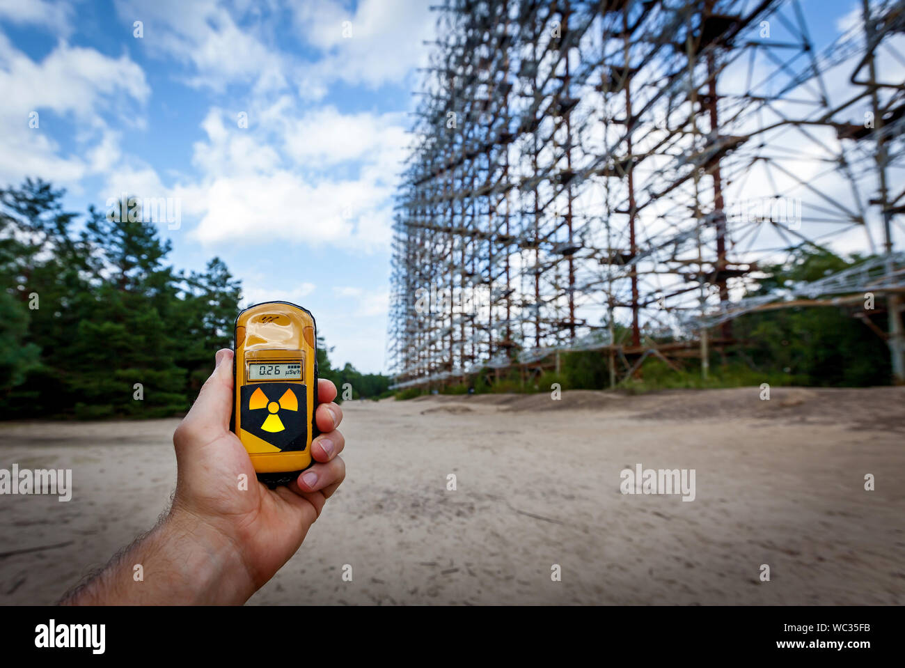 Dosimeter in hands with a level of radioactivity at 0.27 gamma ...