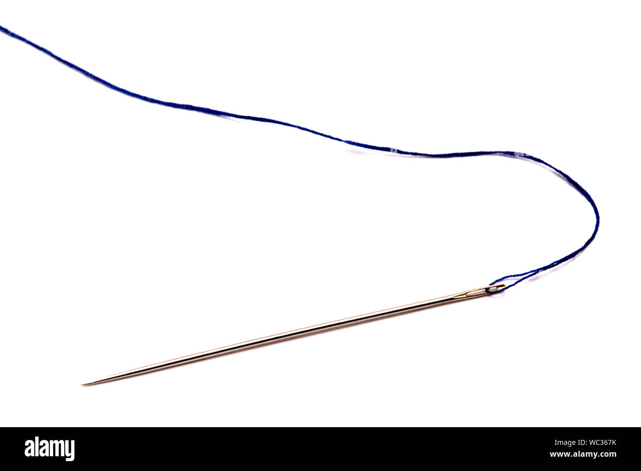 Single spool of blue thread and sewing needle on white background Stock ...