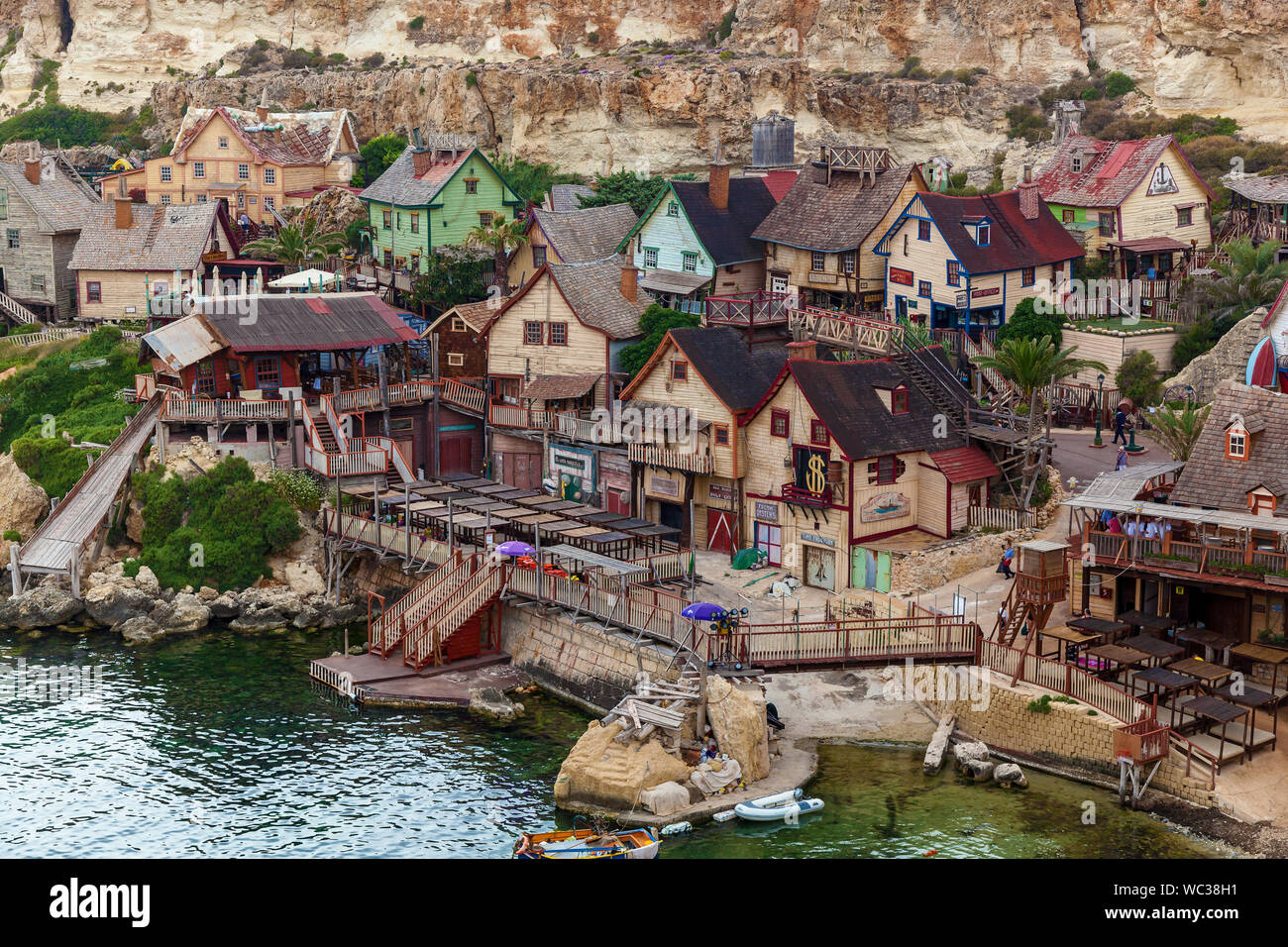 View of the famous village of Popeye with colorful wooden houses and ...