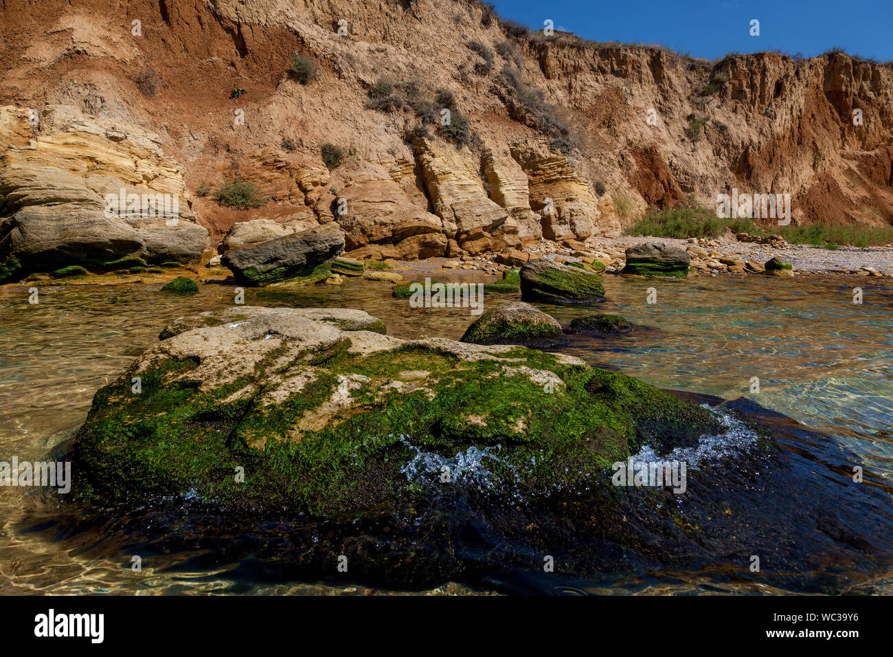 Yellow sandy rocks and stones of various forms on the Black Sea coast ...