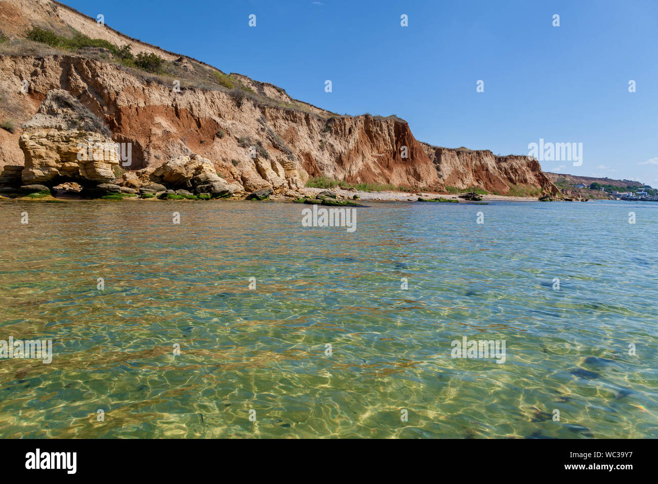 Yellow sandy rocks and stones of various forms on the Black Sea coast ...