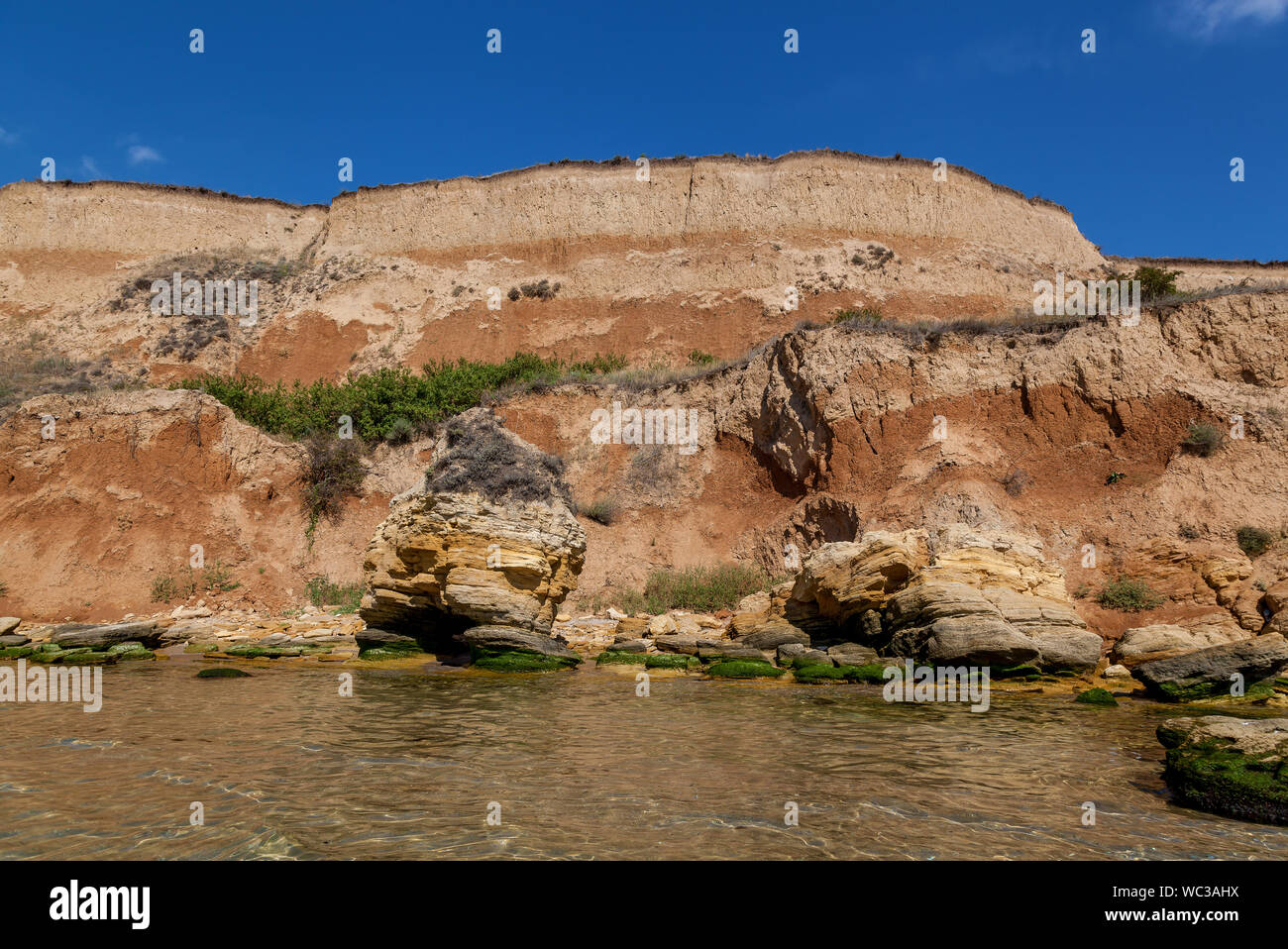Yellow sandy rocks and stones of various forms on the Black Sea coast ...