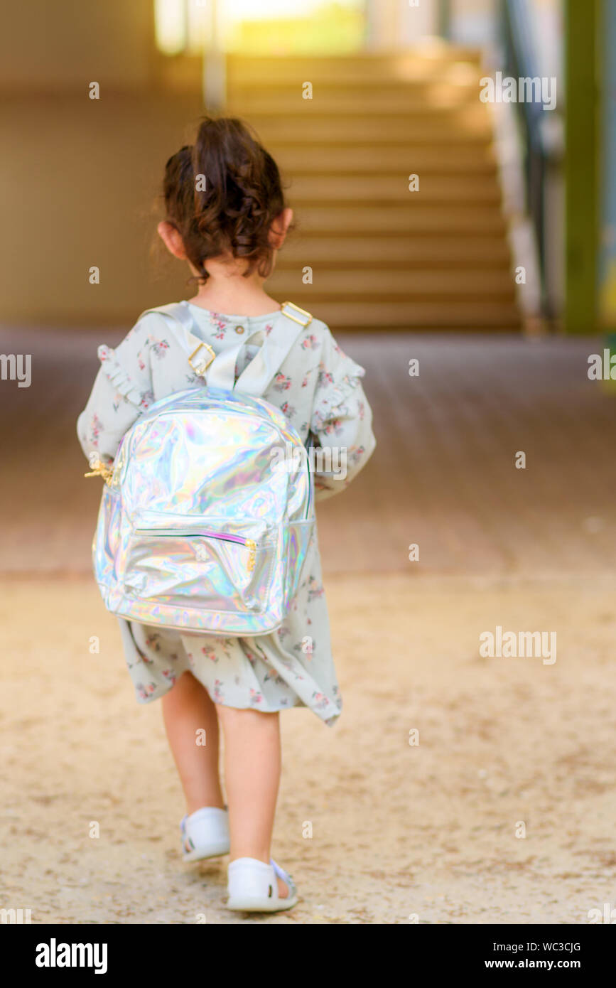 Happy kid back to school. Little girl with backpack go to elementary ...
