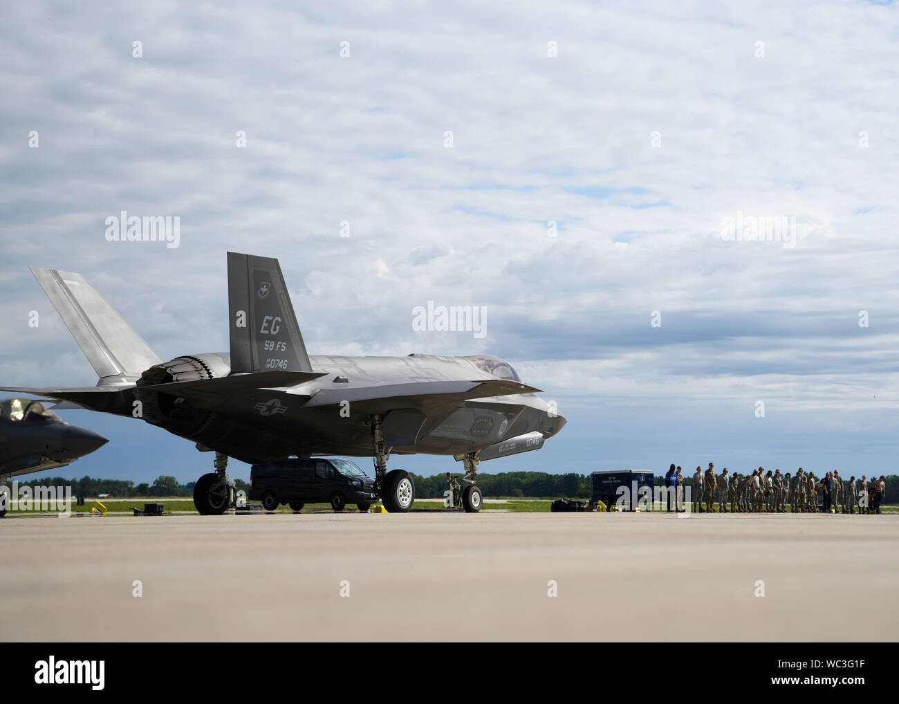 Airmen from the 33rd Fighter Wing cheer as an F-35A Lightning II taxis ...