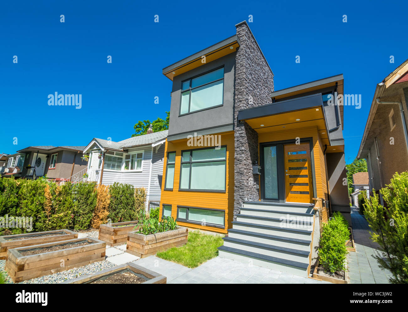 Residential house with concrete pathway and door steps leading to the ...