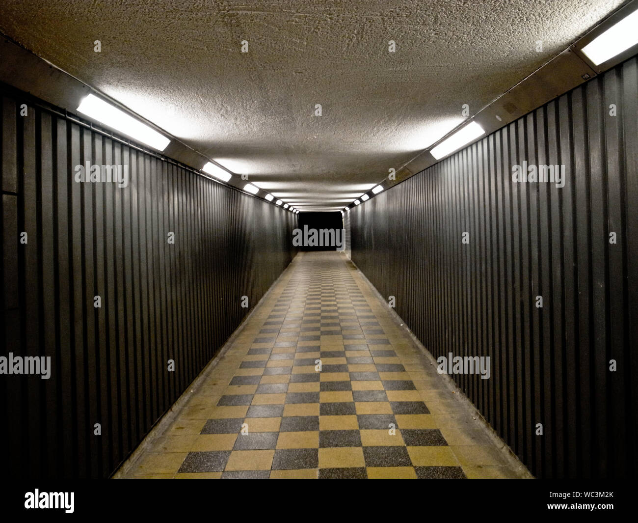 Pathway Through Illuminated Tunnel Stock Photo - Alamy
