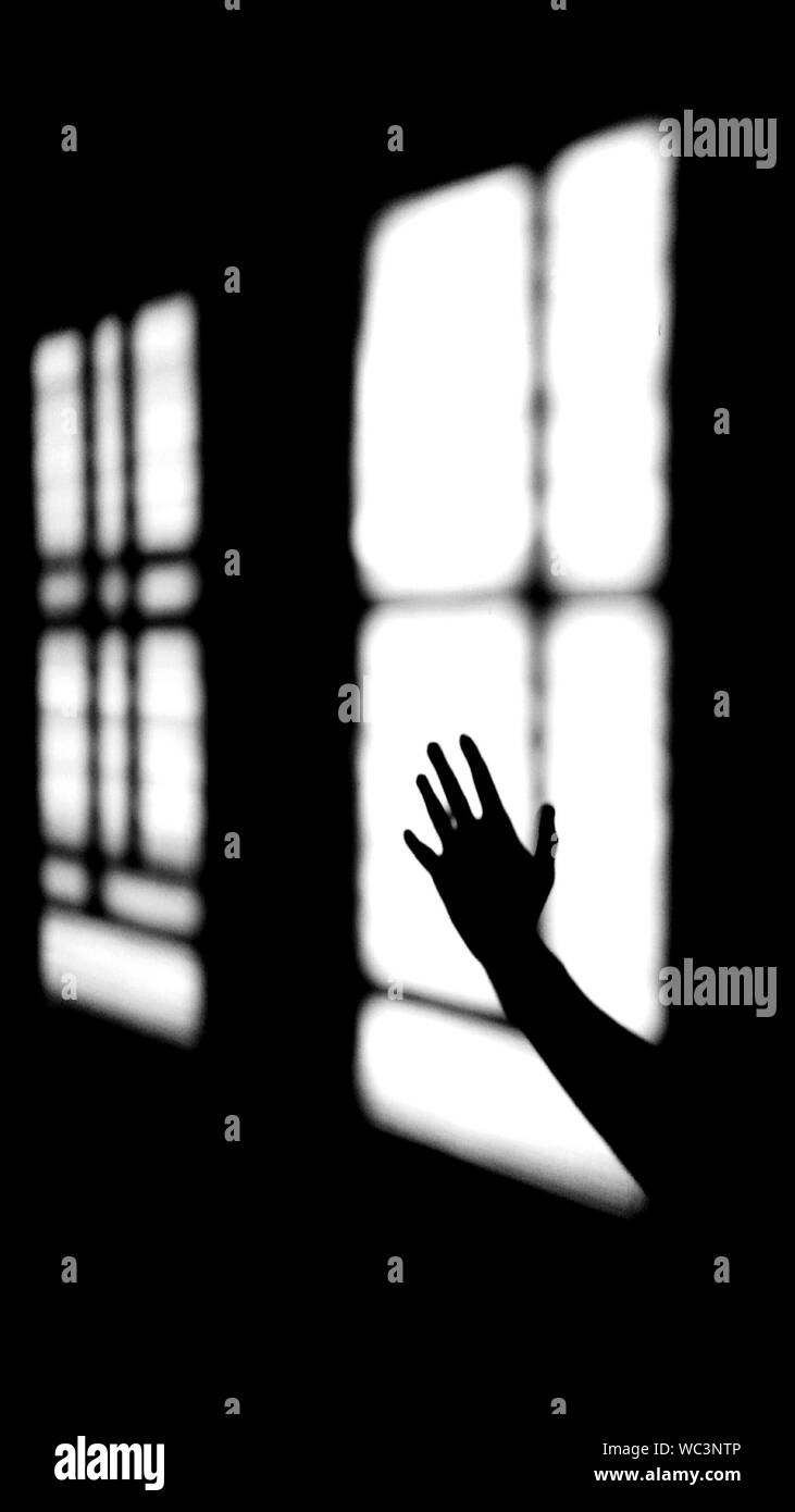 Hand against window hi-res stock photography and images - Alamy