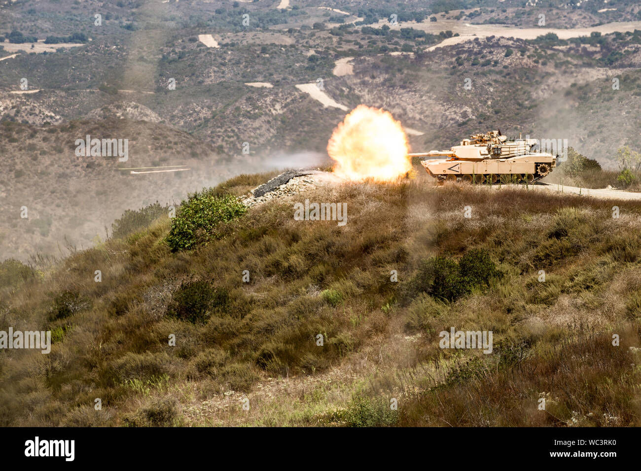 U.S. Marines fire a 120mm round from an M1A1 Abrams Main Battle Tank ...