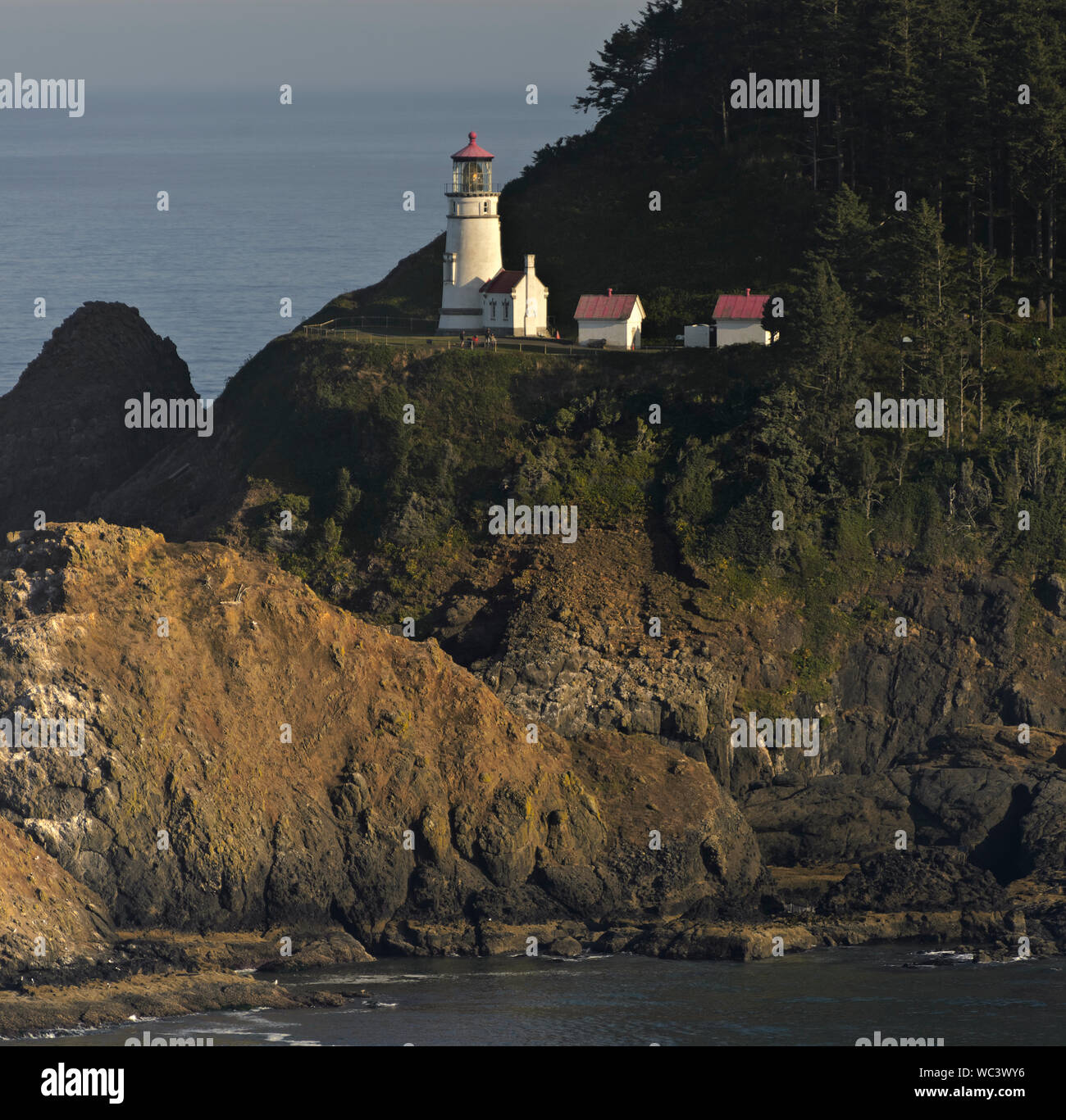 Heceta Head Lighthouse, on the Oregon Coast, sits atop sheer cliffs and ...