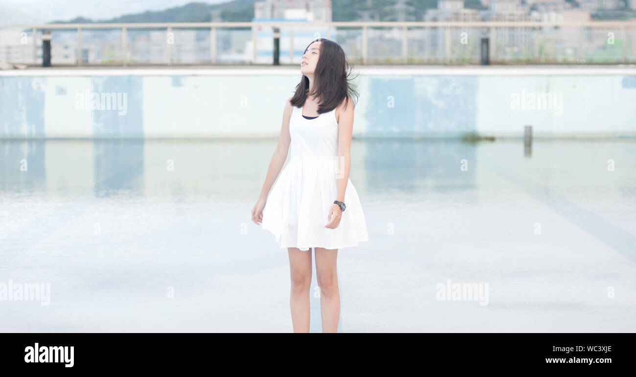 Woman standing swimming pool day hi-res stock photography and images ...