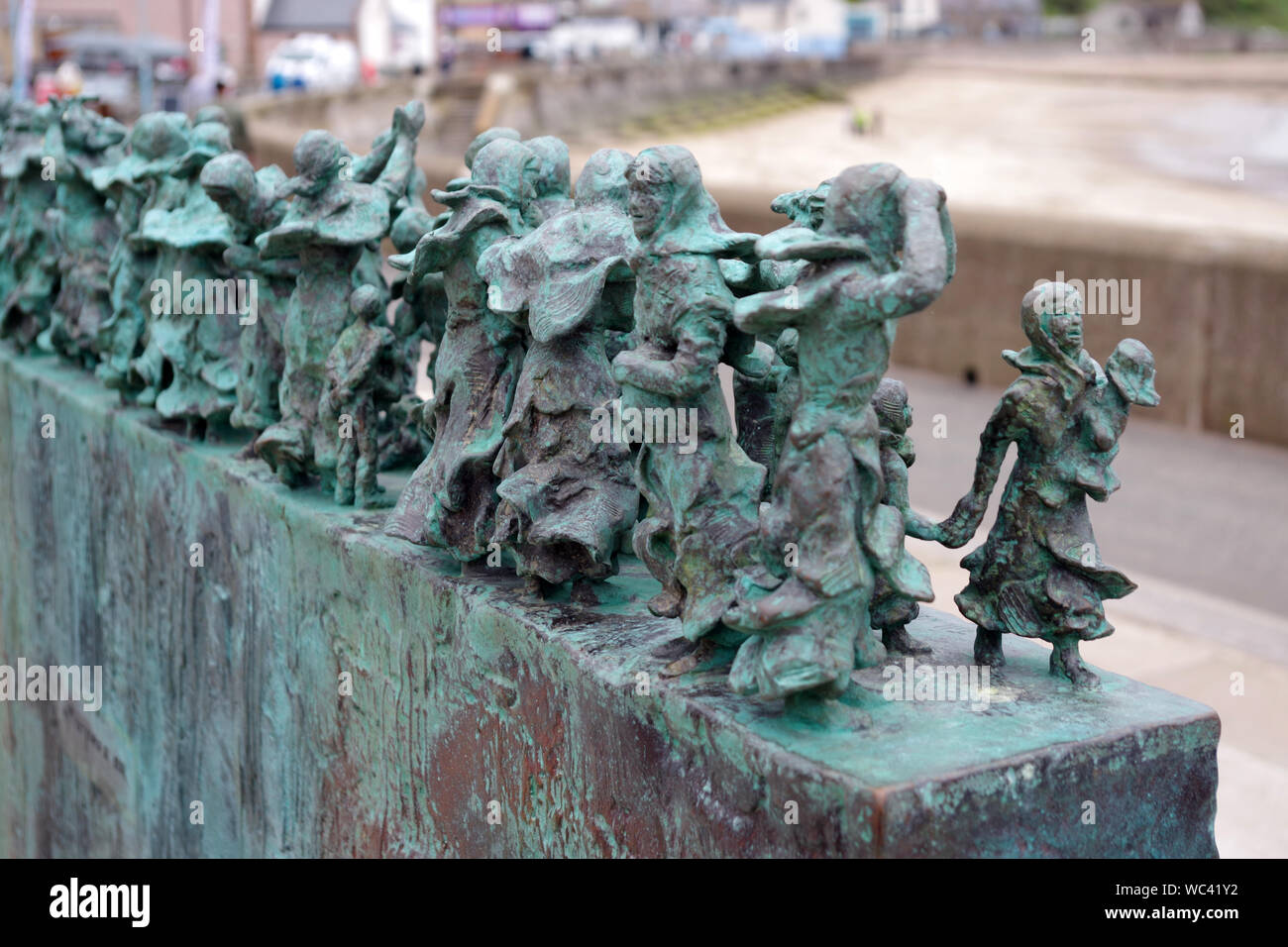 'Widows & Bairns' sculpture in Eyemouth. A memorial shows the widows ...