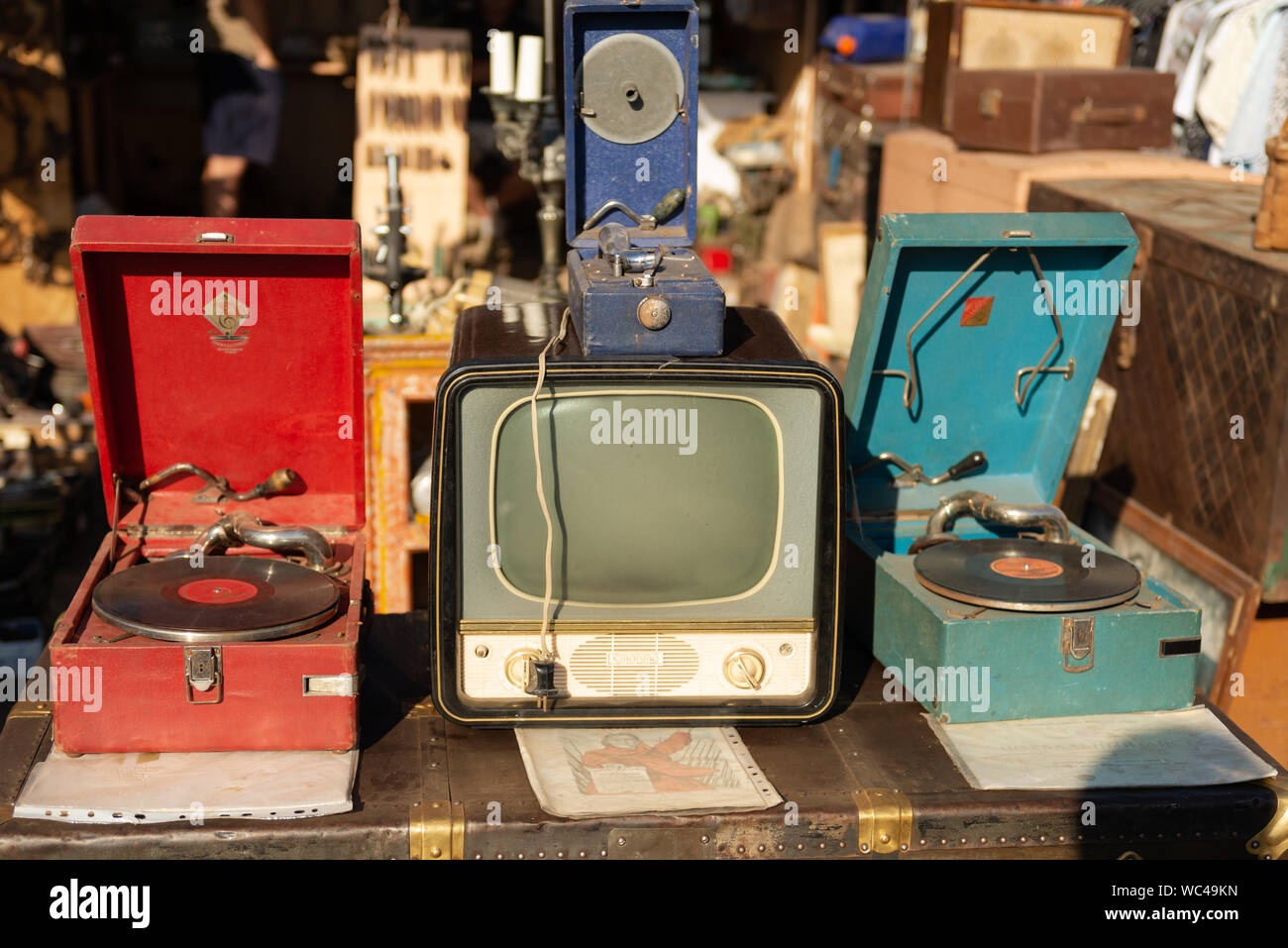 Flea market. Sale of old things. Record players and the first TV set ...