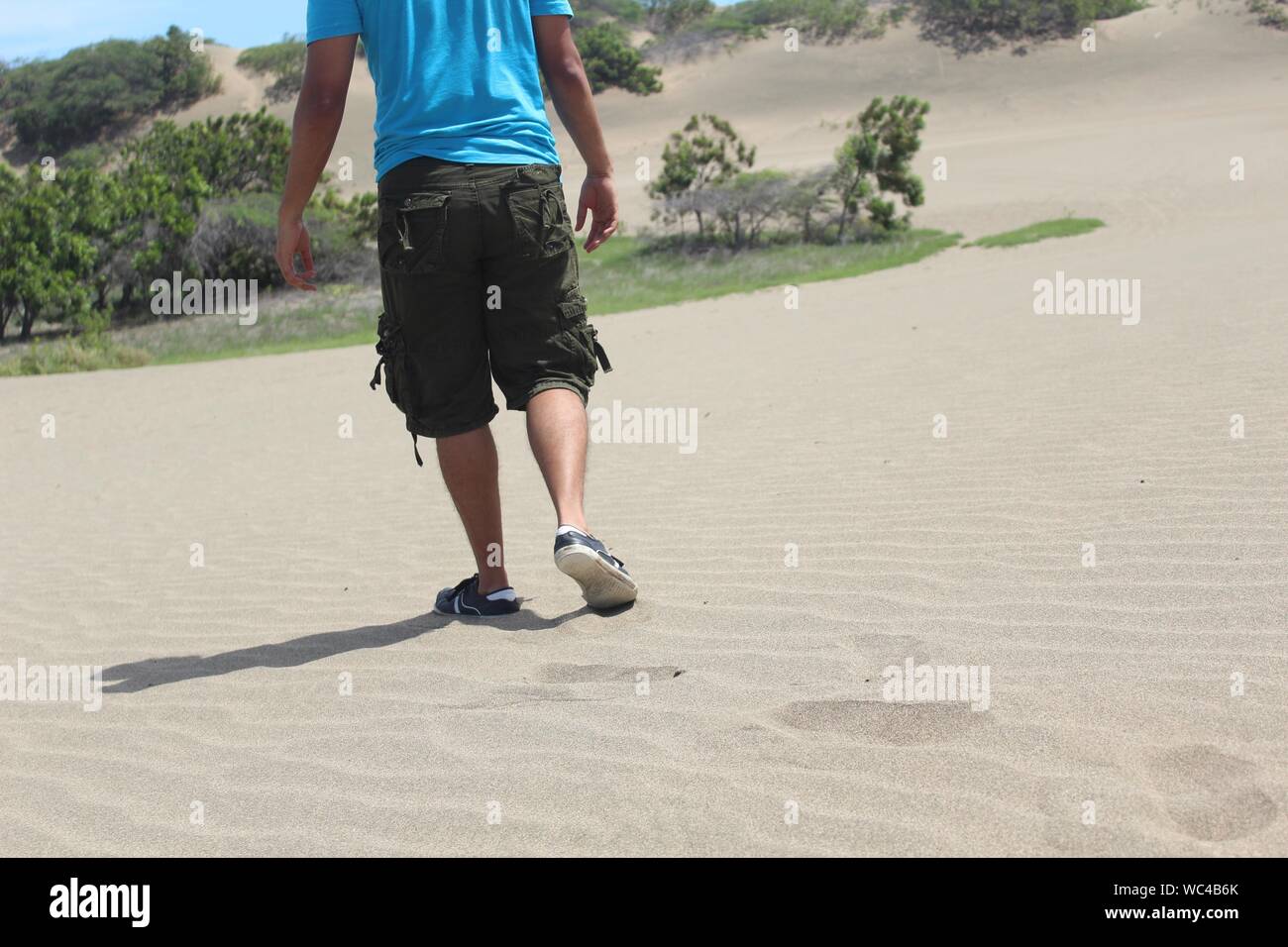 Man walking in the sand hi-res stock photography and images - Alamy