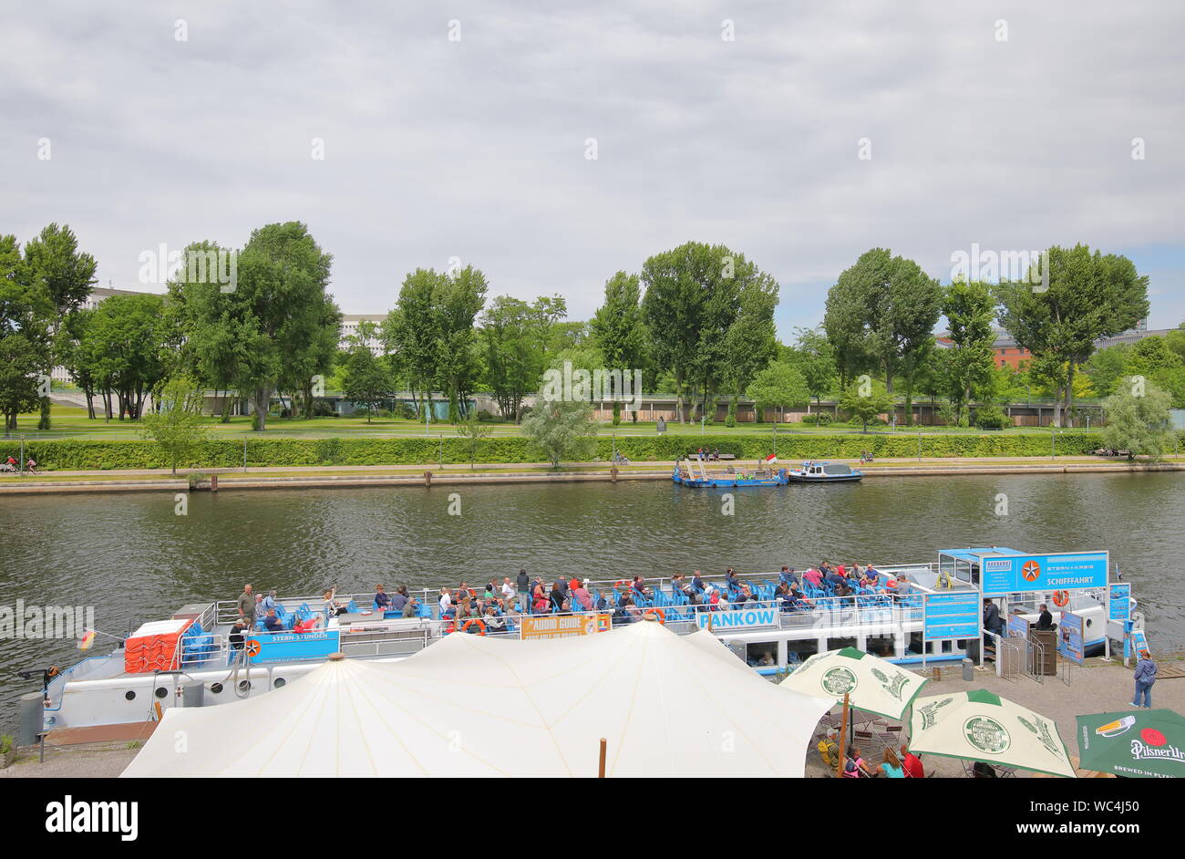 People take Spree river cruise in Berlin Germany Stock Photo - Alamy