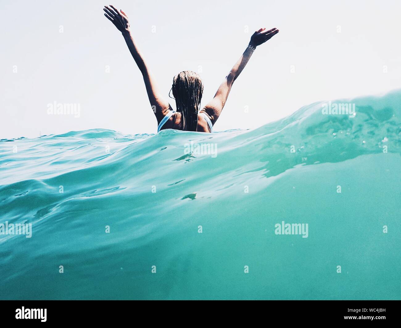 Young Woman Swimming In Sea Stock Photo - Alamy