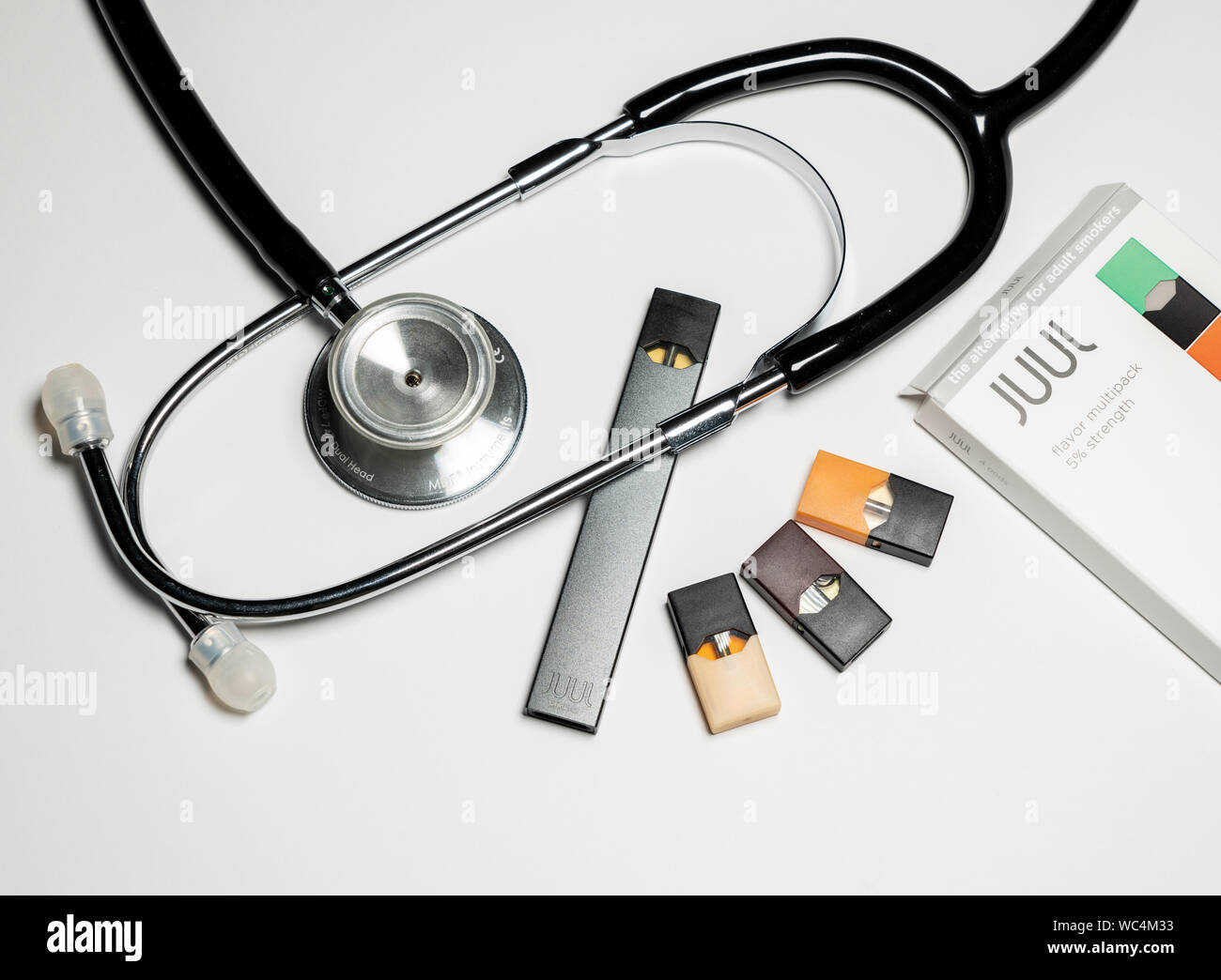 Box holding JUUL nicotine dispenser and pods with stethoscope Stock ...