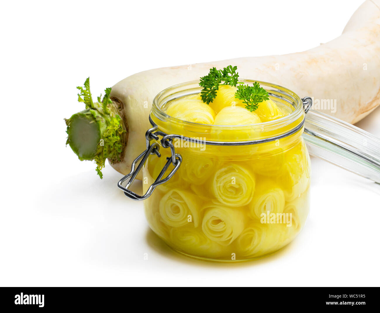 Marinated daikon on white background in the glass jar Stock Photo - Alamy