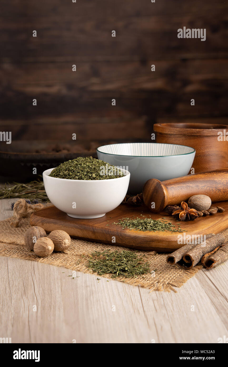 Dried Chervil Herb in a bowl and food preparation and kitchen setting ...