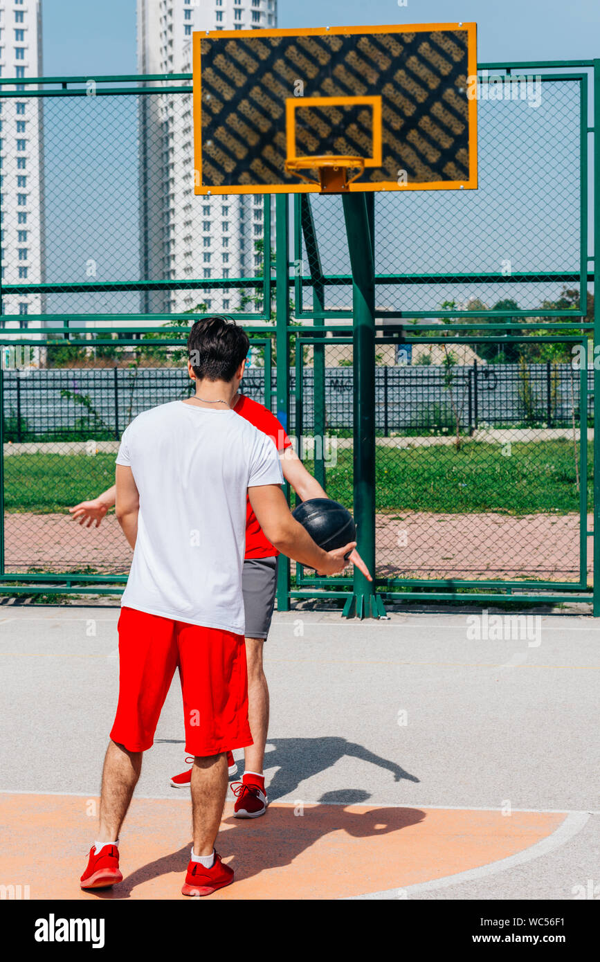 Basketball players playing ball(pushing, dribbling) on an urban ...