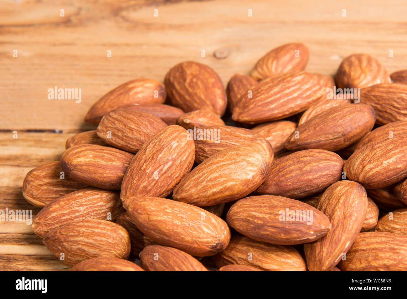 Almonds on table hi-res stock photography and images - Alamy