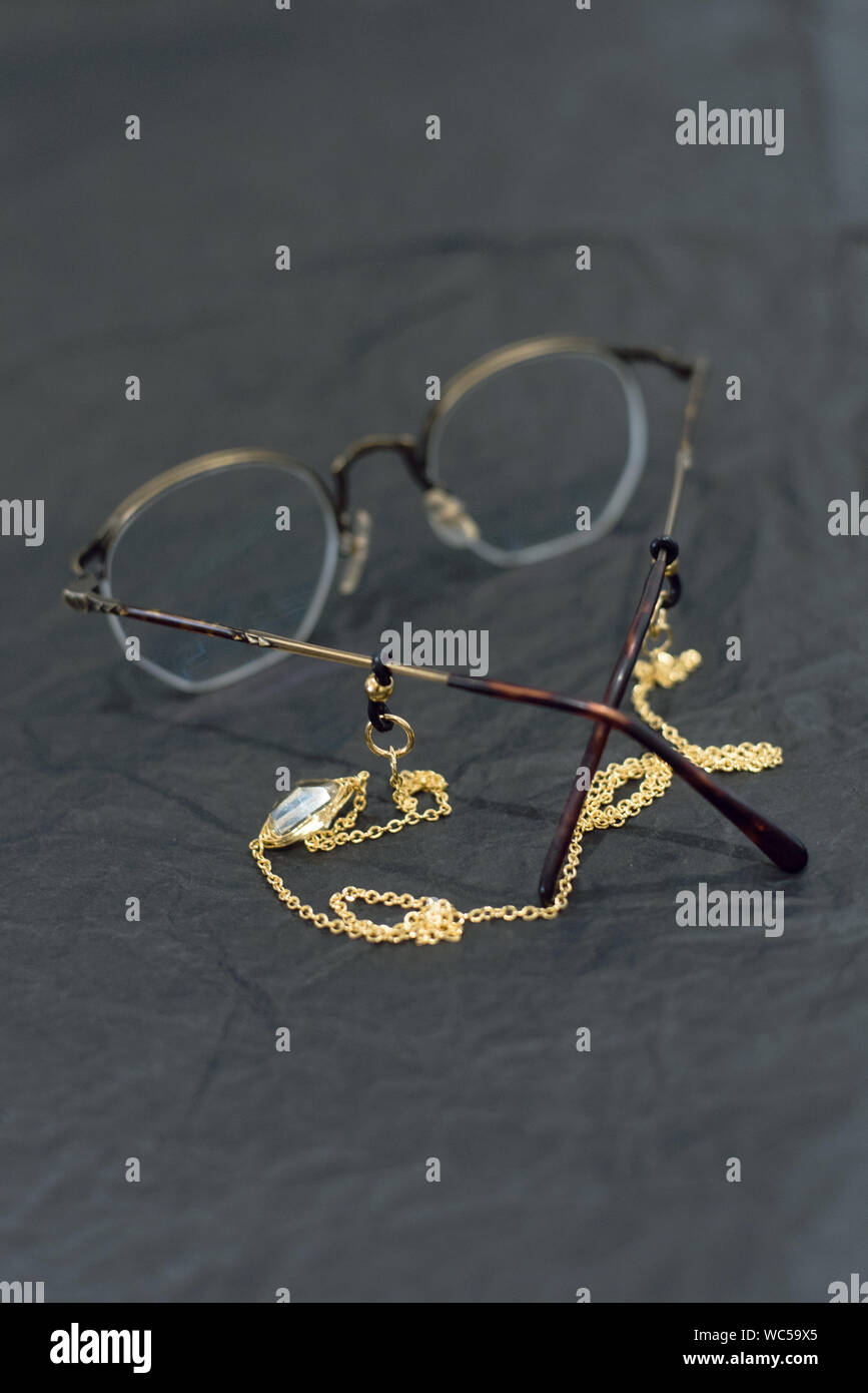 stylish gold chain with a transparent gem on the glasses. trend on ...