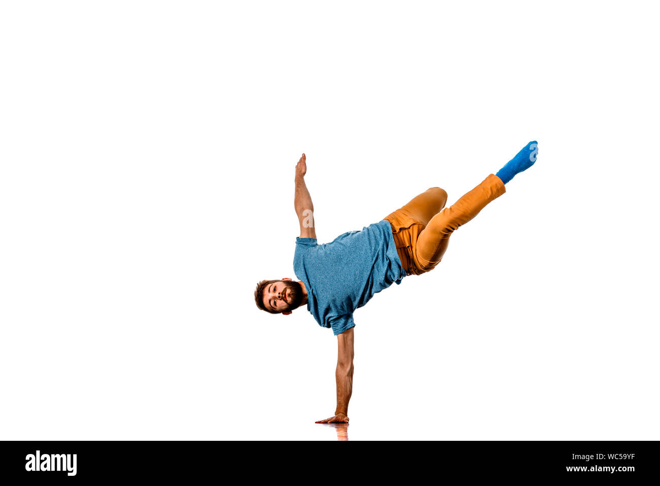 Portrait of a young man dancing of joy. Isolated image on white ...