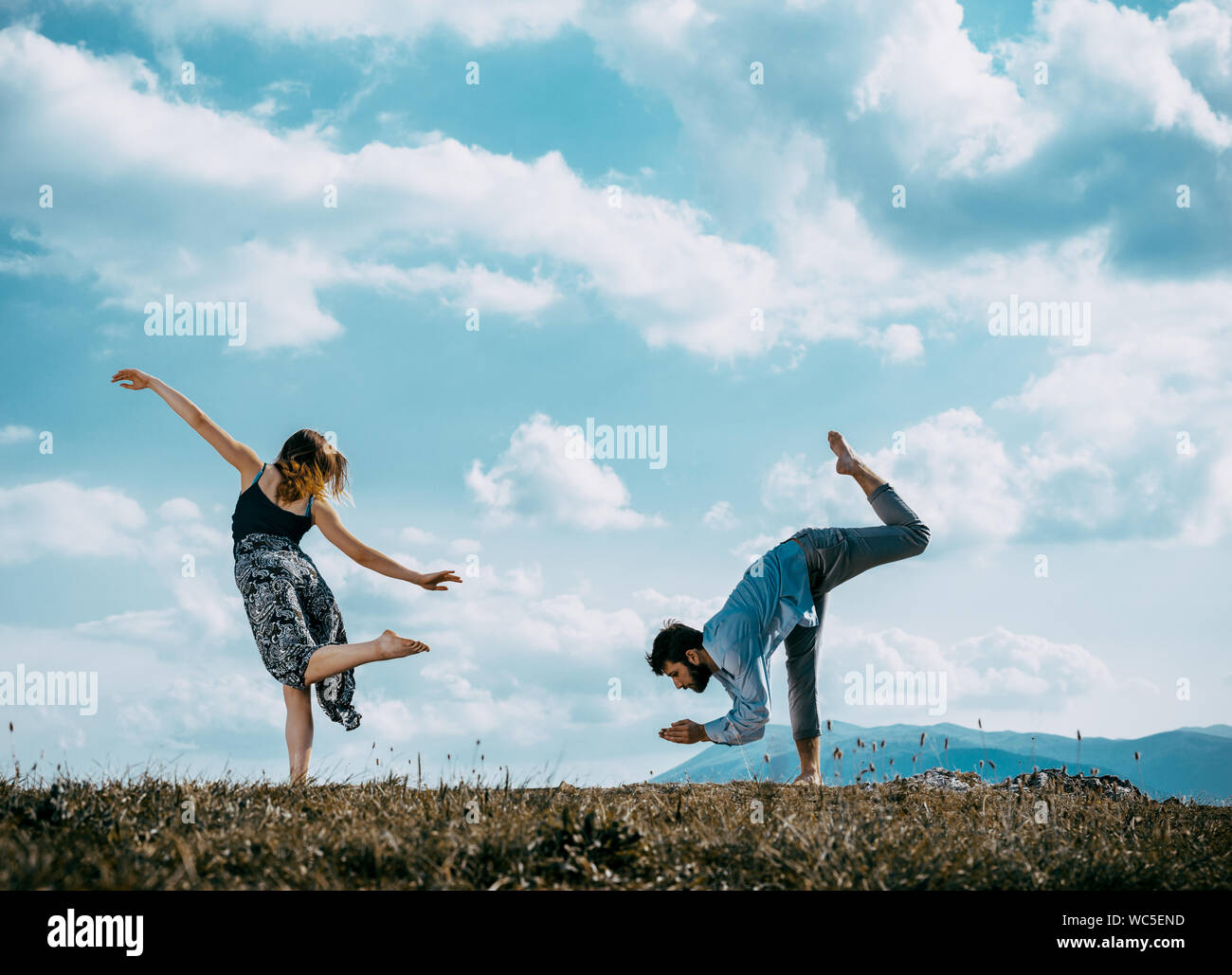 Hip-hop dancers in action. Young couple of casual dancers performing ...