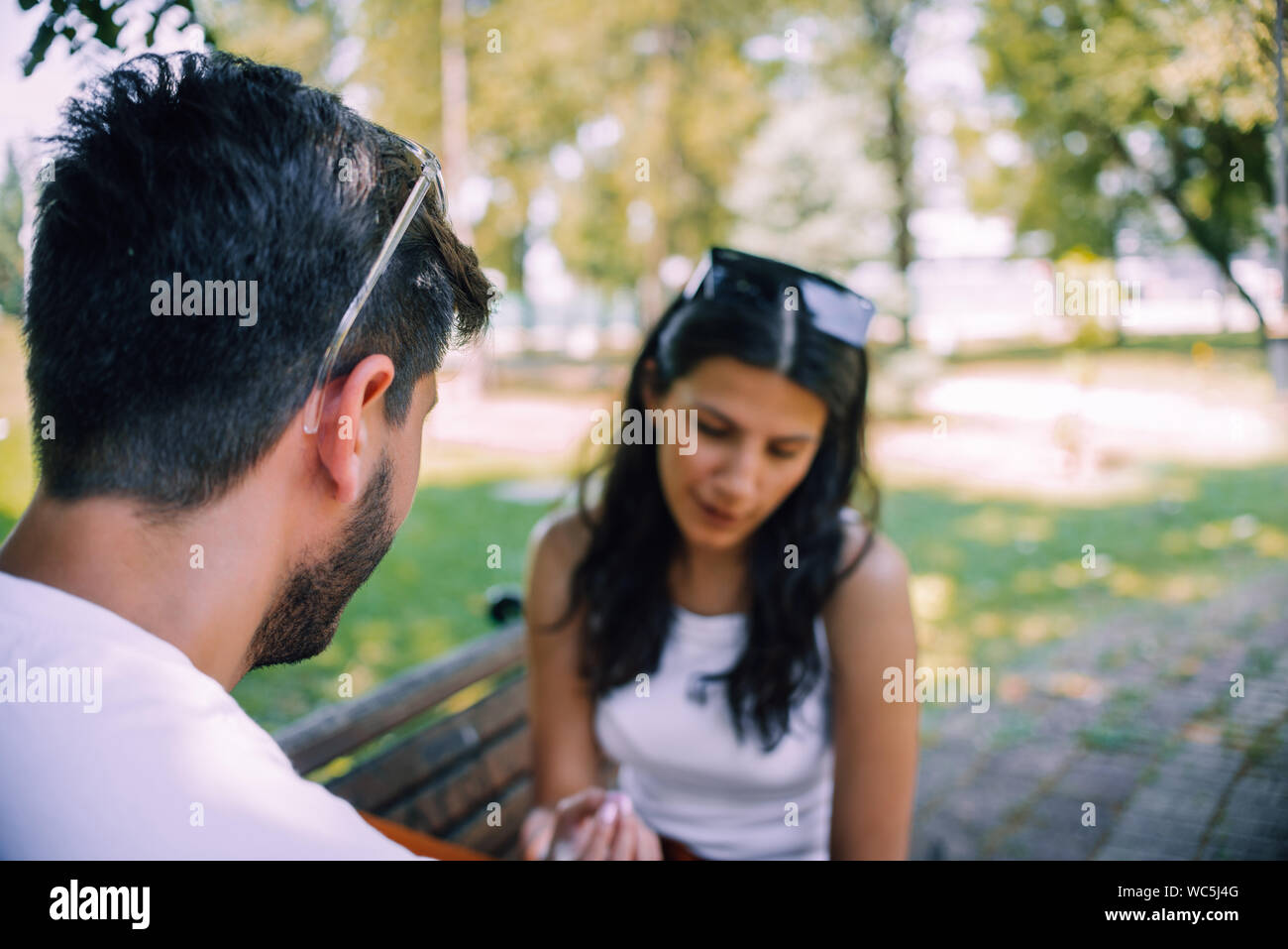 Best friends enjoying time together outdoors on bench. Concept of two ...